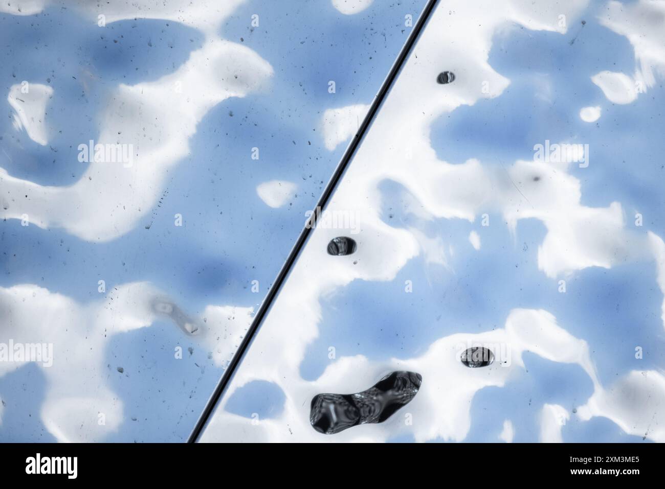 Blue shiny metal wall structure with a gap between steel plates ...