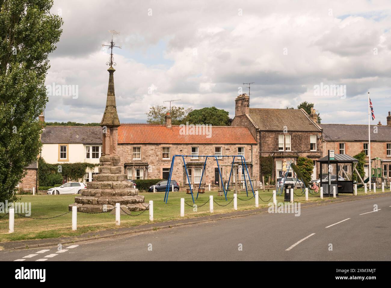 Children playing on Norham village green, Northumberland, England, UK ...