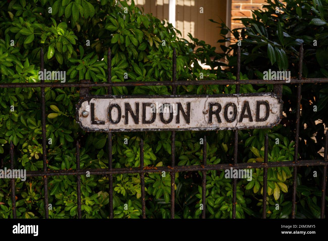 Traditional street name sign, "London Road" in Dorchester, Dorset Stock ...