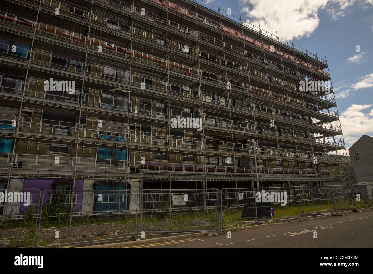 Building under construction, with completely scaffolding against it ...