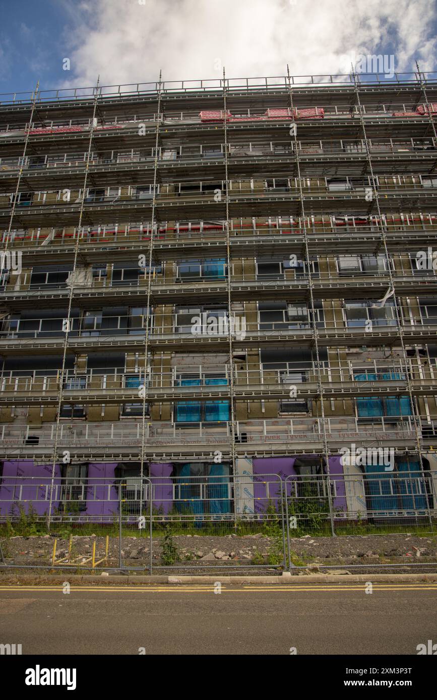 Building under construction, with completely scaffolding against it ...