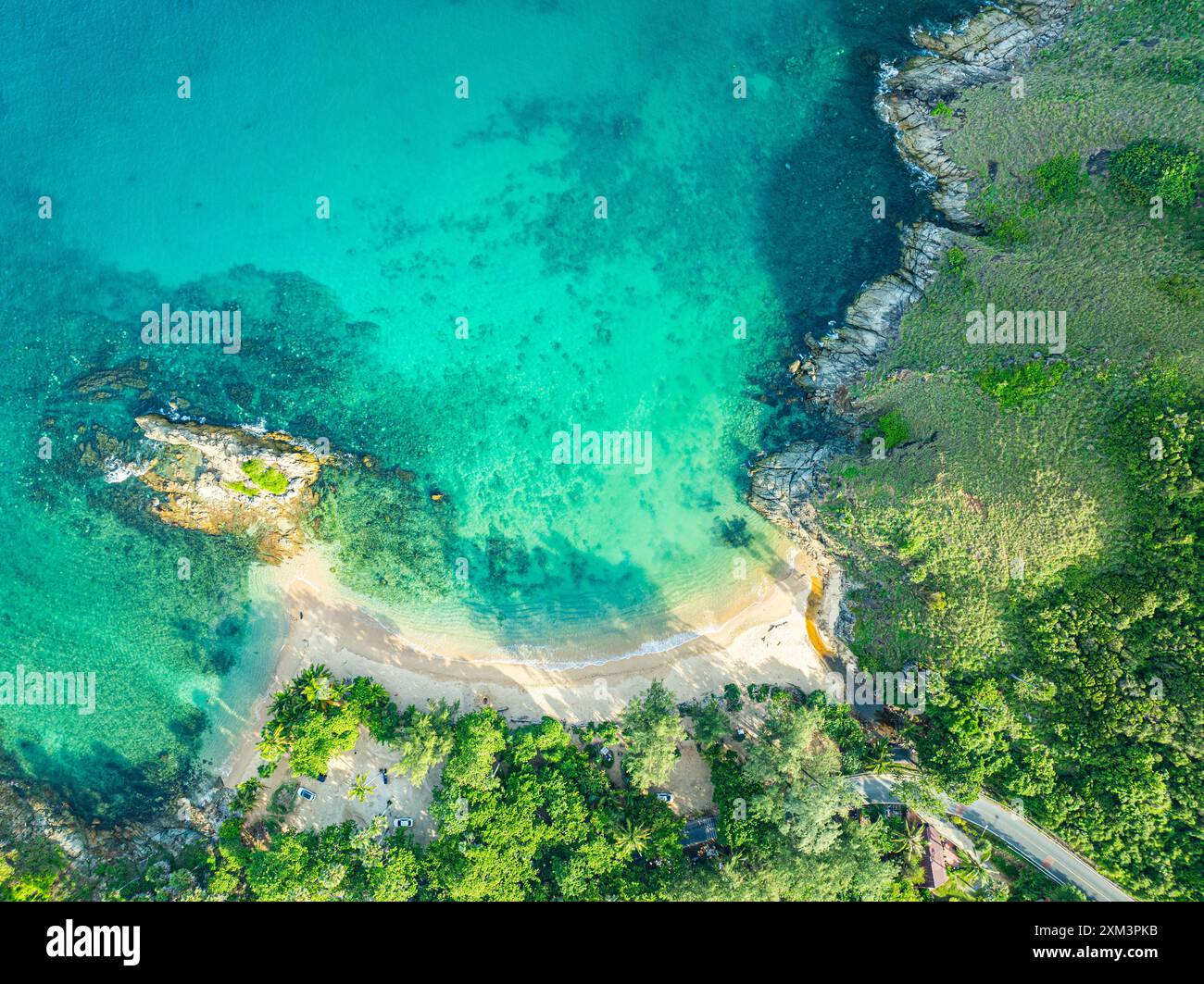 aerial top view above small island in front of Yanui beach in low tide ...