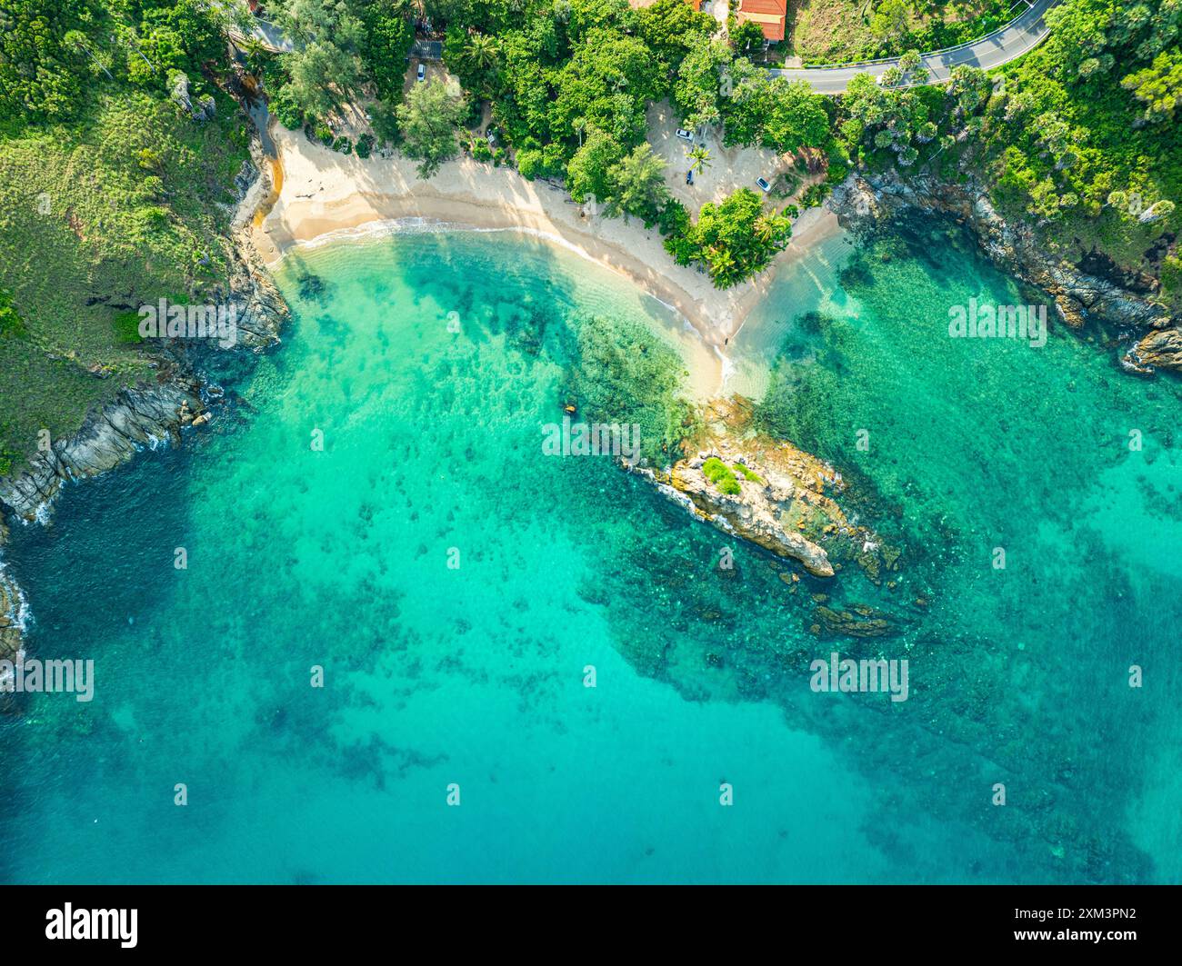 aerial top view above small island in front of Yanui beach in low tide ...