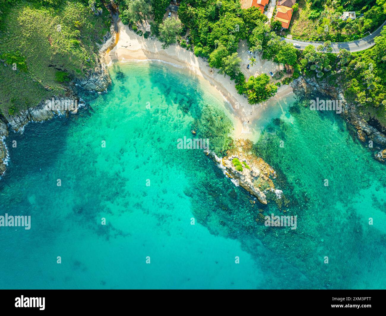 aerial top view above small island in front of Yanui beach in low tide ...