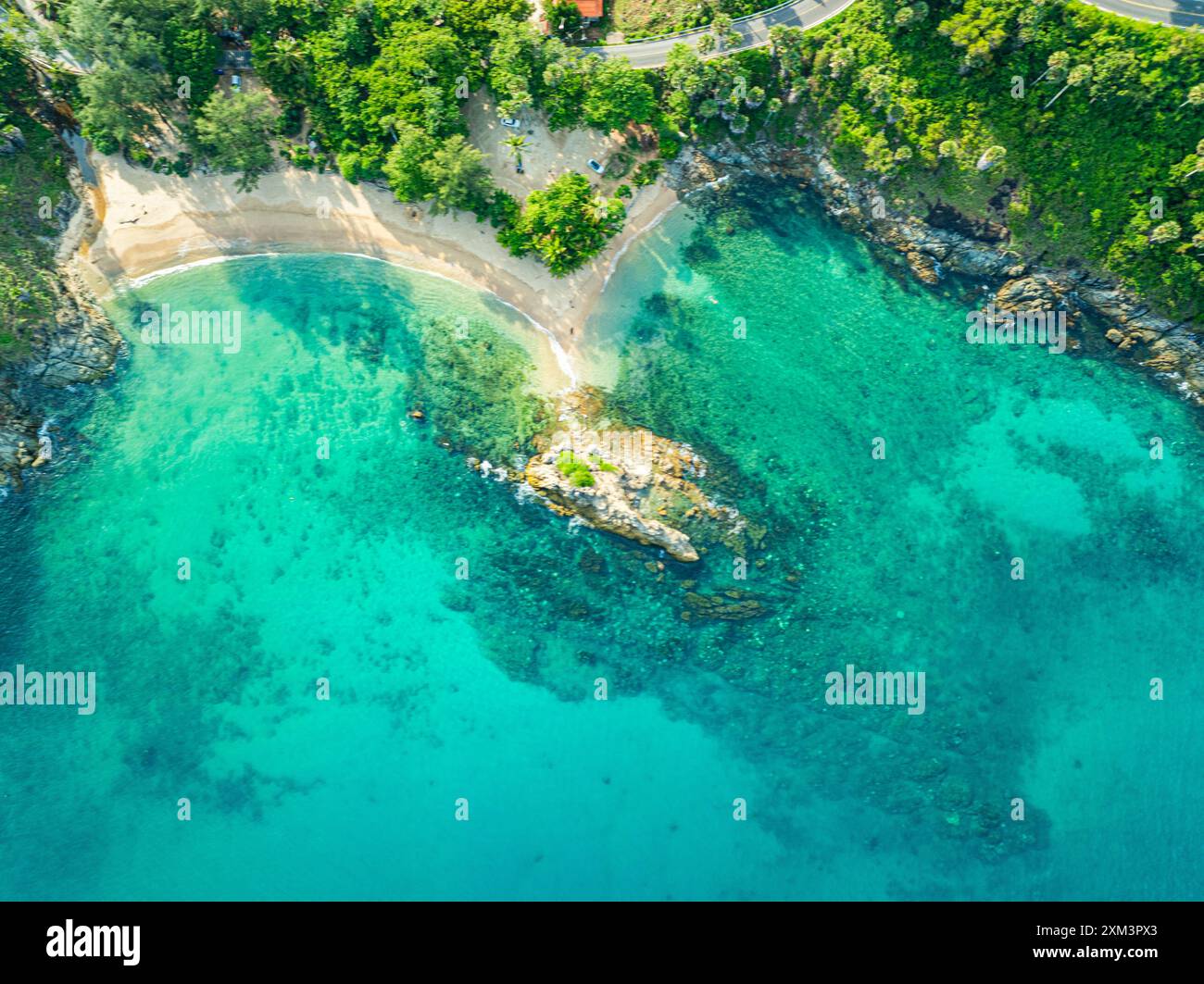 aerial top view above small island in front of Yanui beach in low tide ...