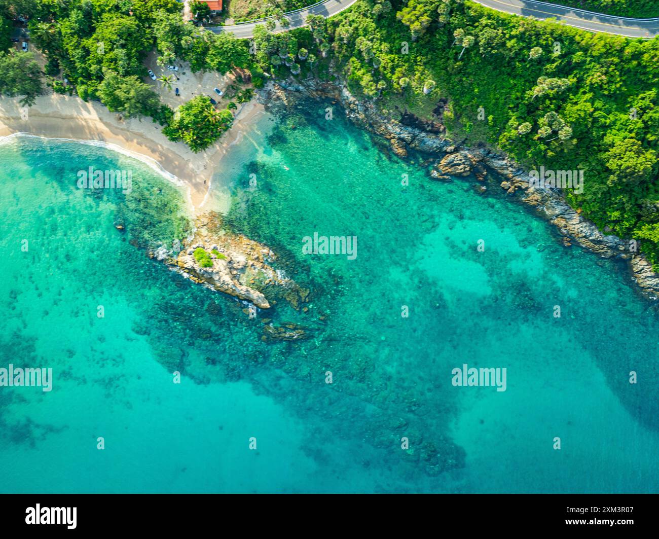 aerial top view above small island in front of Yanui beach in low tide ...
