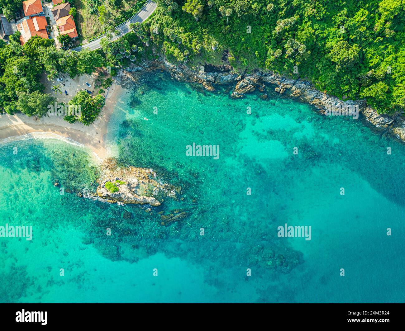 aerial top view above small island in front of Yanui beach in low tide ...