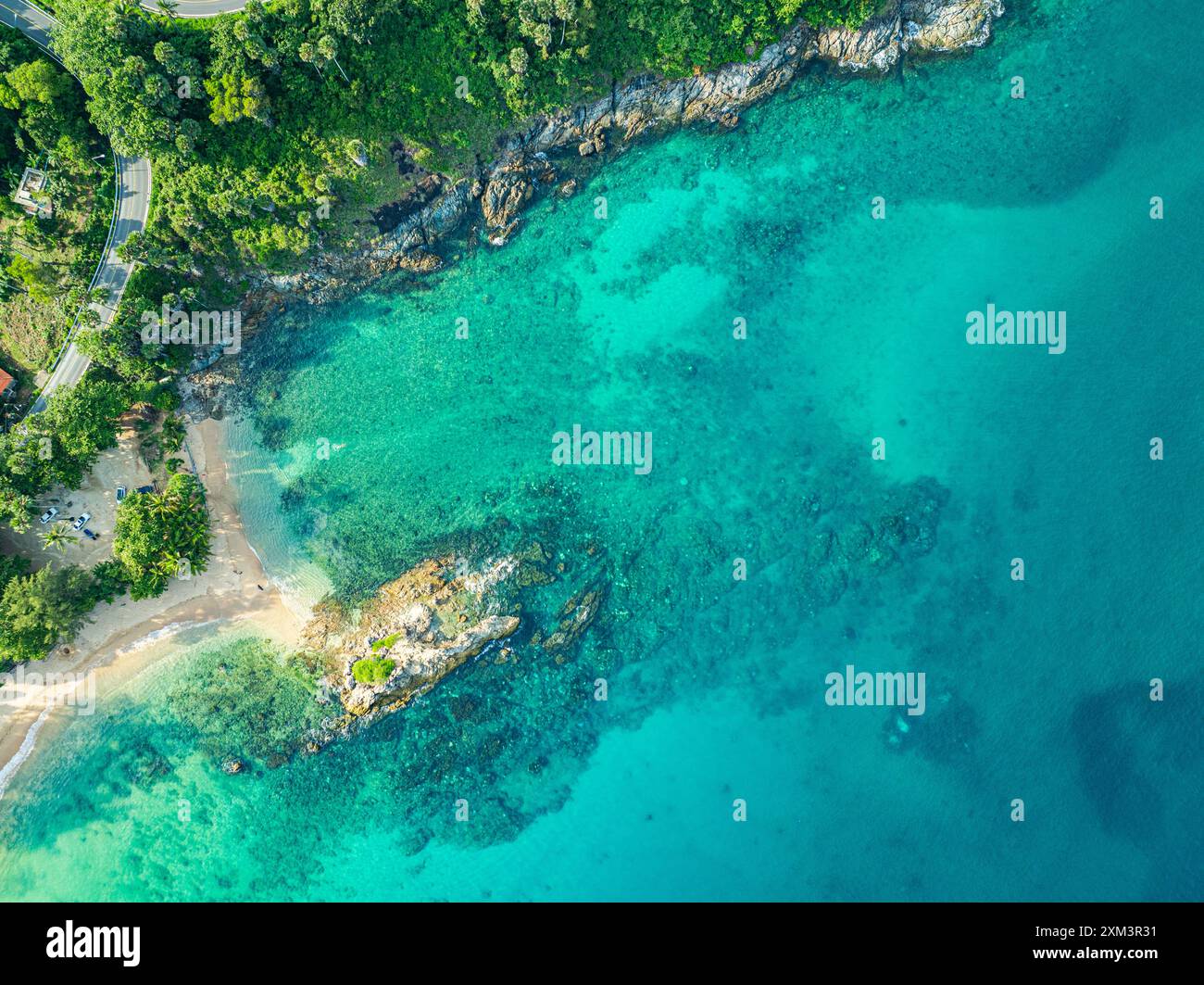aerial top view above small island in front of Yanui beach in low tide ...