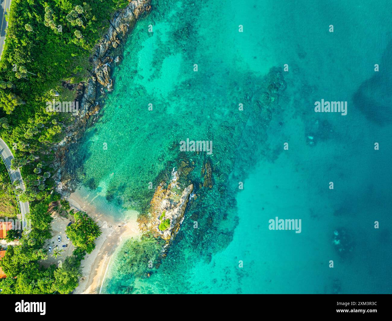 aerial top view above small island in front of Yanui beach in low tide ...