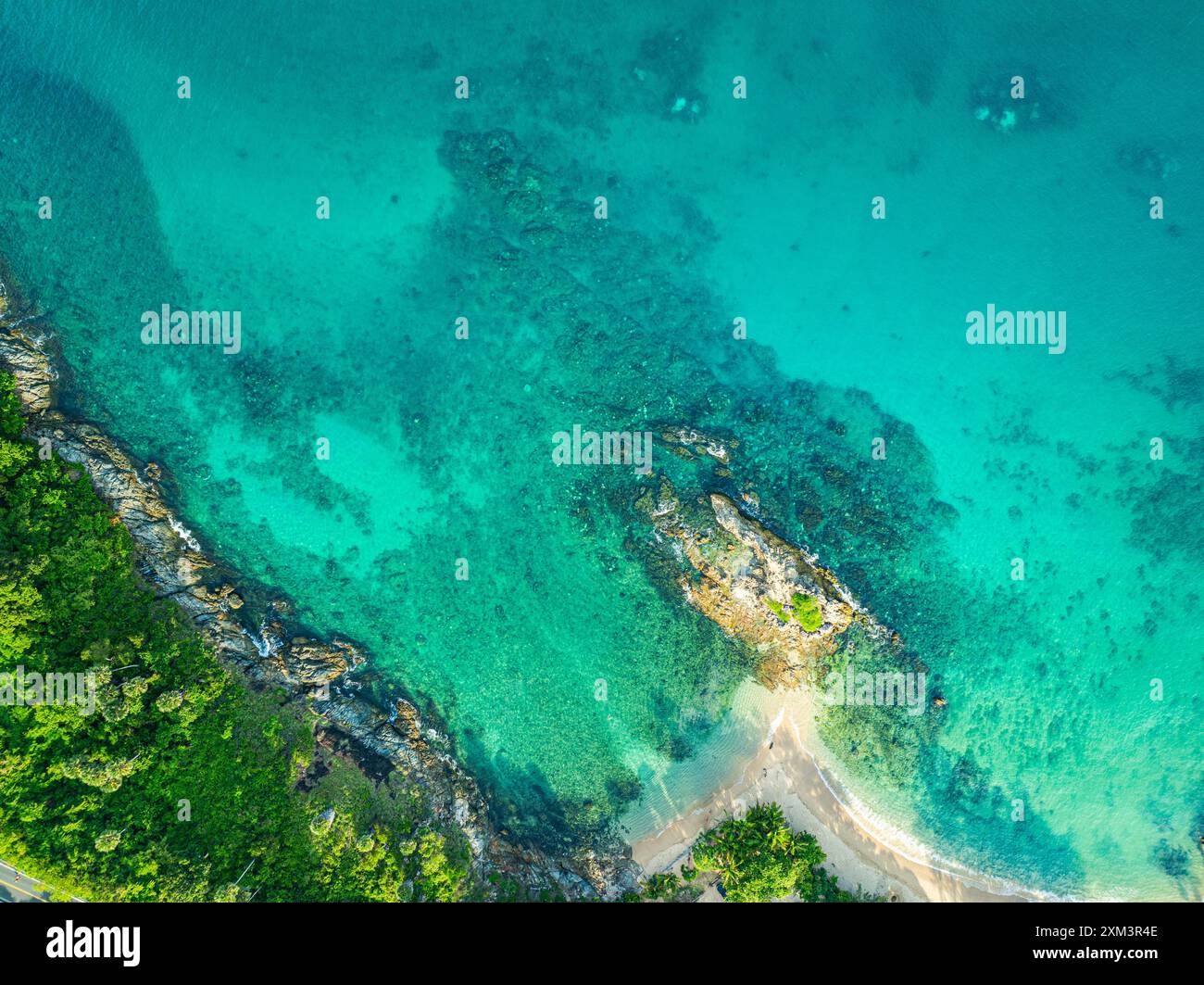 aerial top view above small island in front of Yanui beach in low tide ...