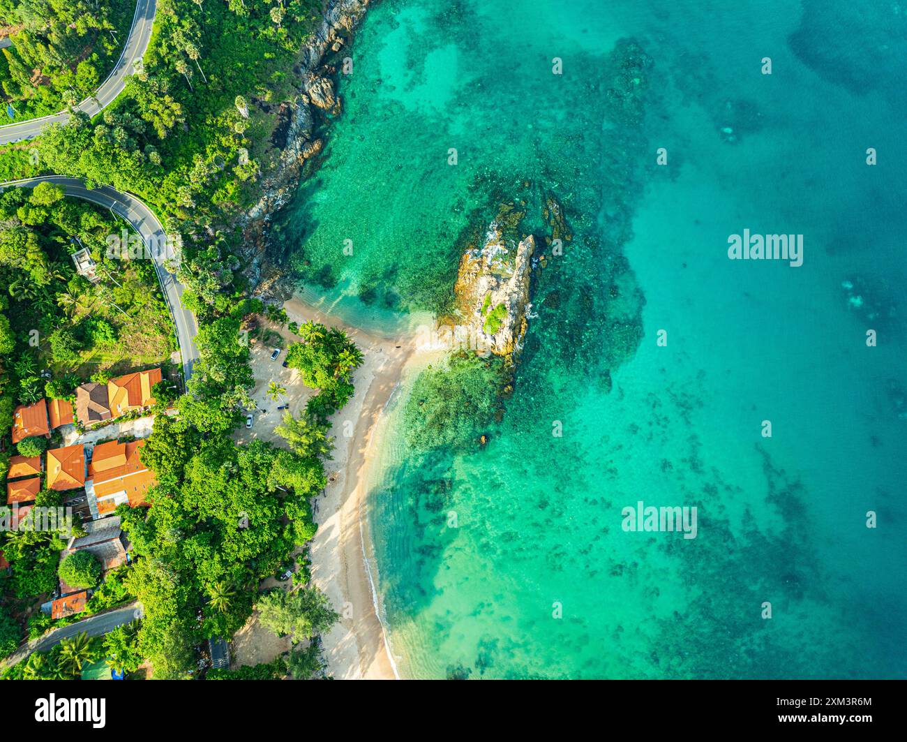 aerial top view above small island in front of Yanui beach in low tide ...
