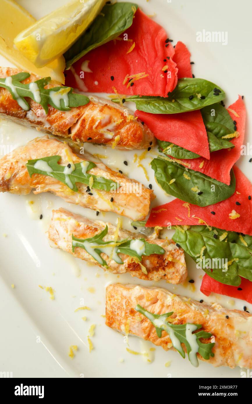 Grilled Salmon fillet with marinated vegetables served on the ...