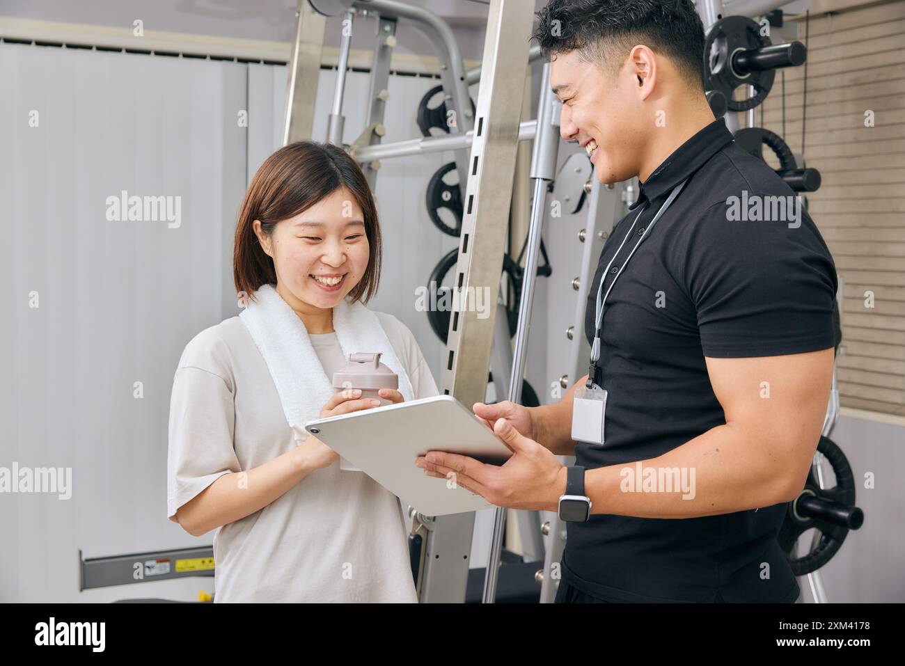 Young woman personal trainer tablet hi-res stock photography and images ...