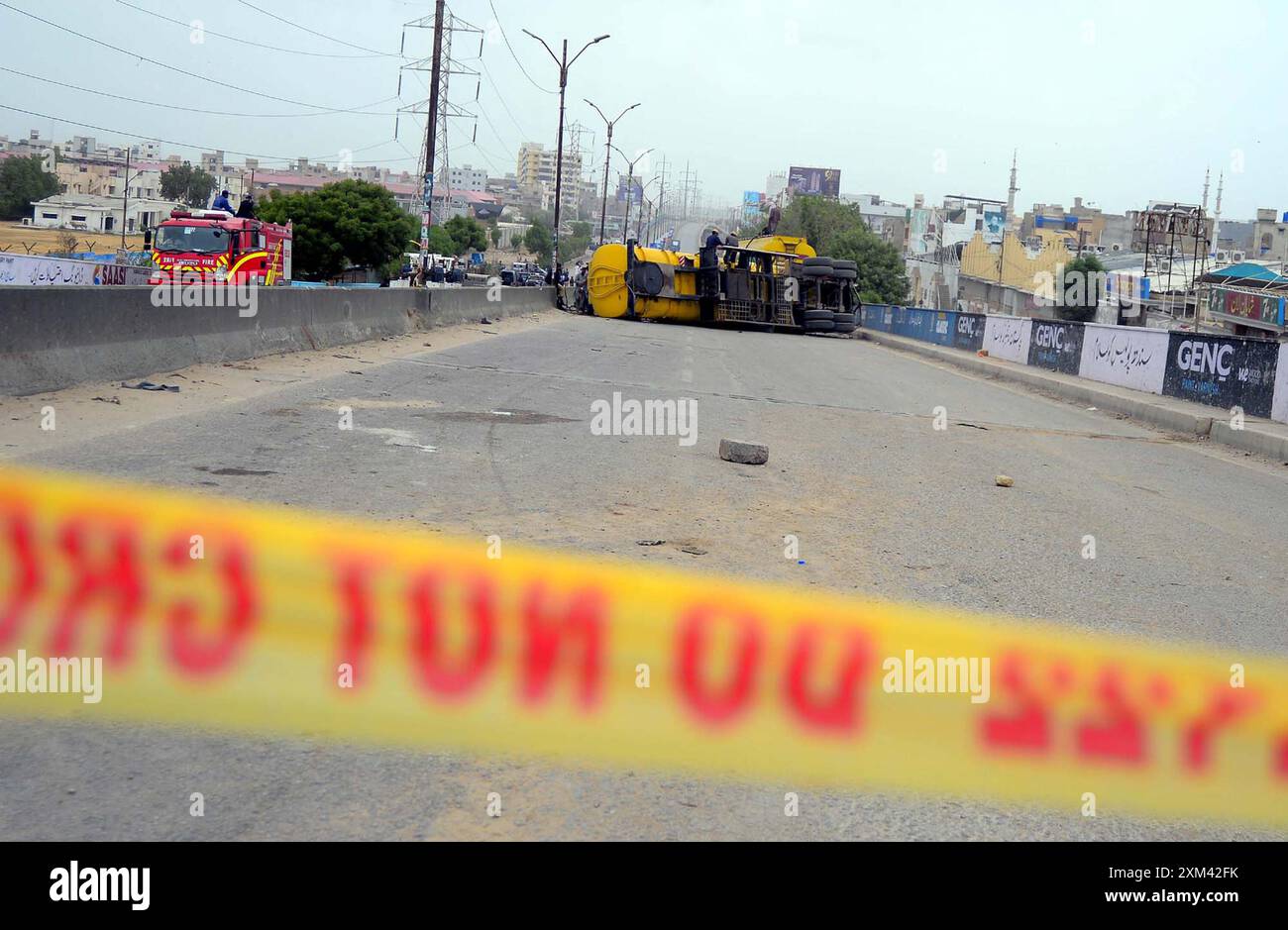 View an overturned oil-tanker that was fells down due to over speeding ...