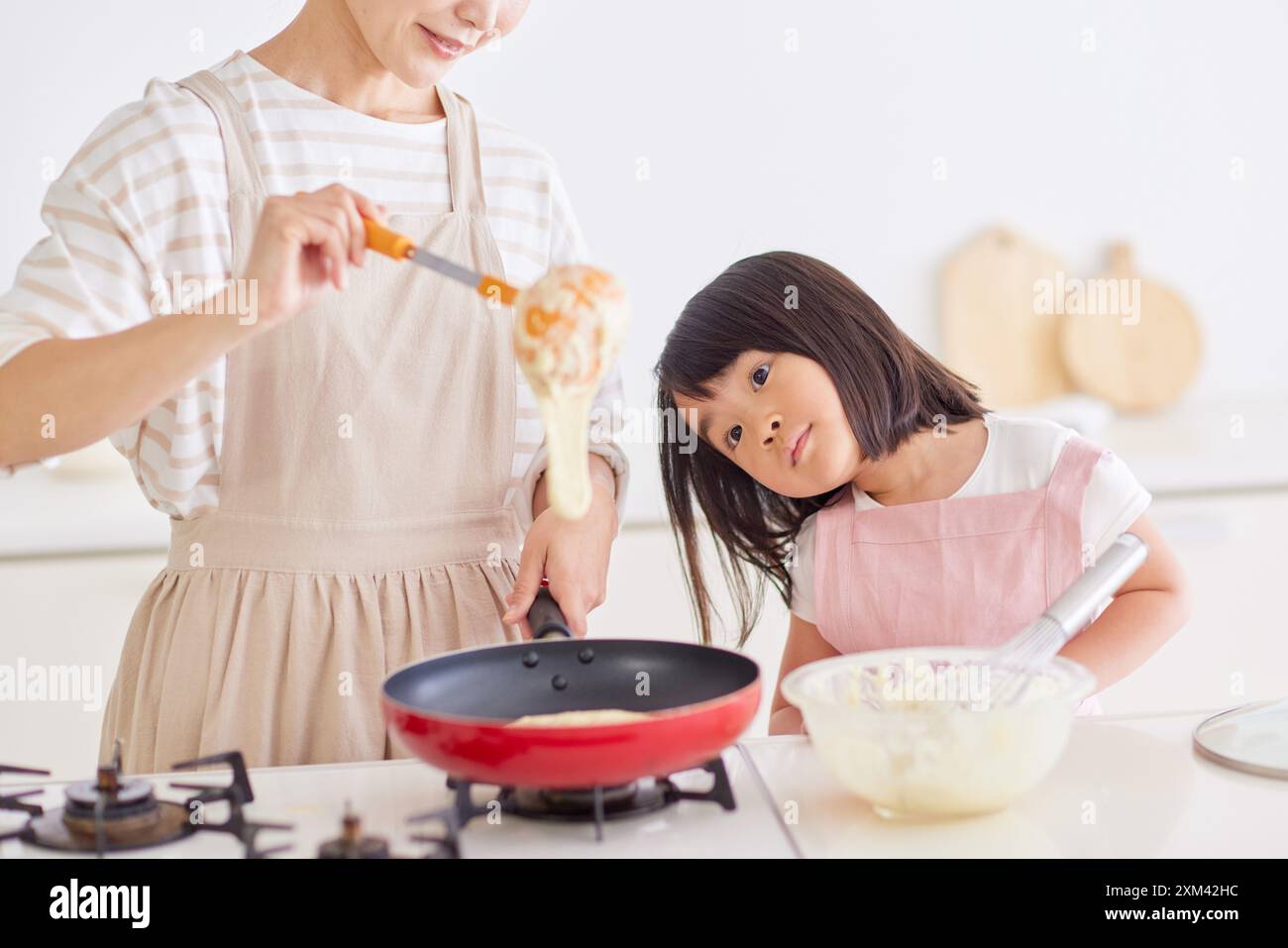 Japanese mother and daughter cooking in the kitchen Stock Photo - Alamy
