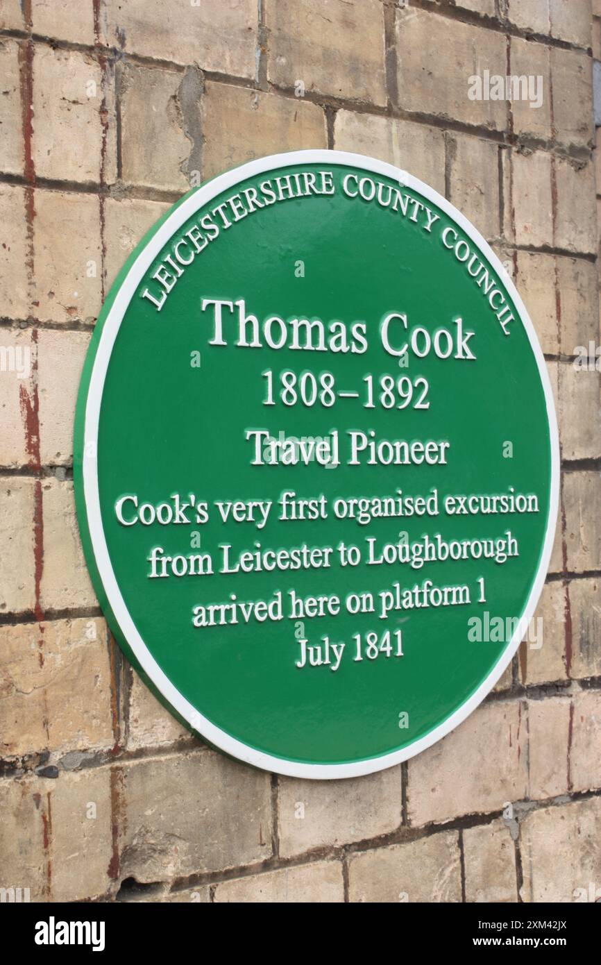 A green plaque at Loughborough railway station commemorating the first ...
