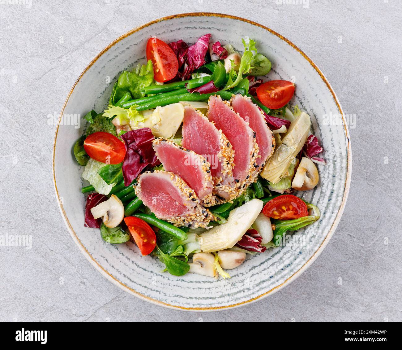 Tuna salad on a gray background. Nicoise salad, for restaurant menu for ...