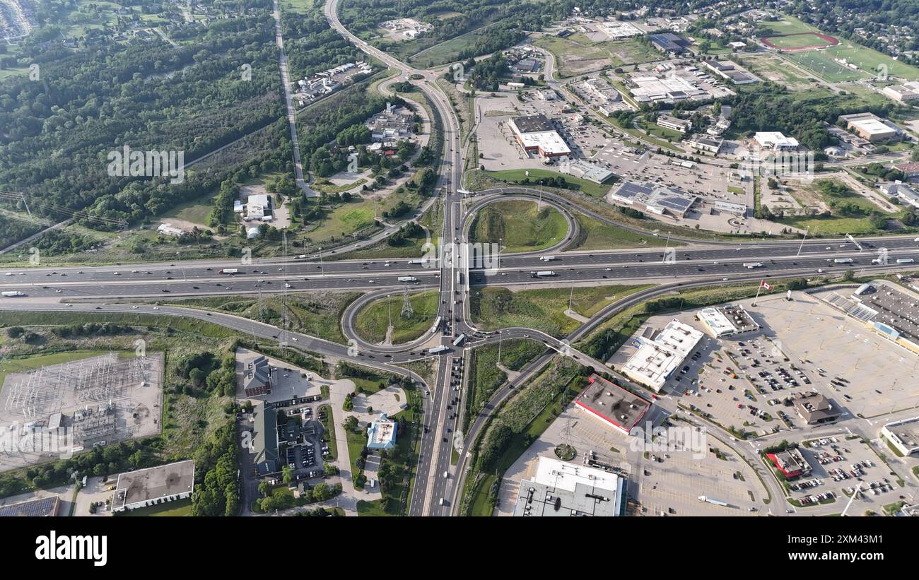 An aerial view of a highway interchange with surrounding commercial and ...