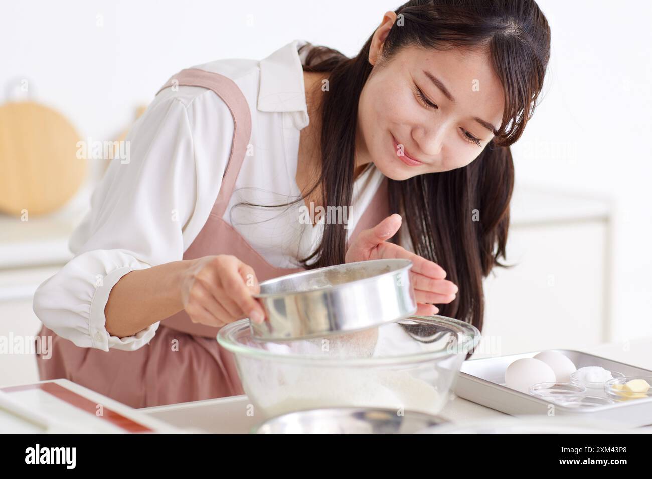 Japanese woman cooking in the kitchen Stock Photo - Alamy