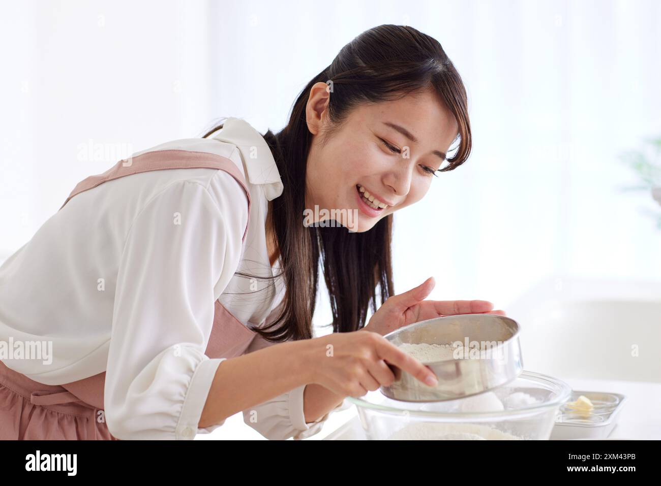 Japanese woman cooking in the kitchen Stock Photo - Alamy