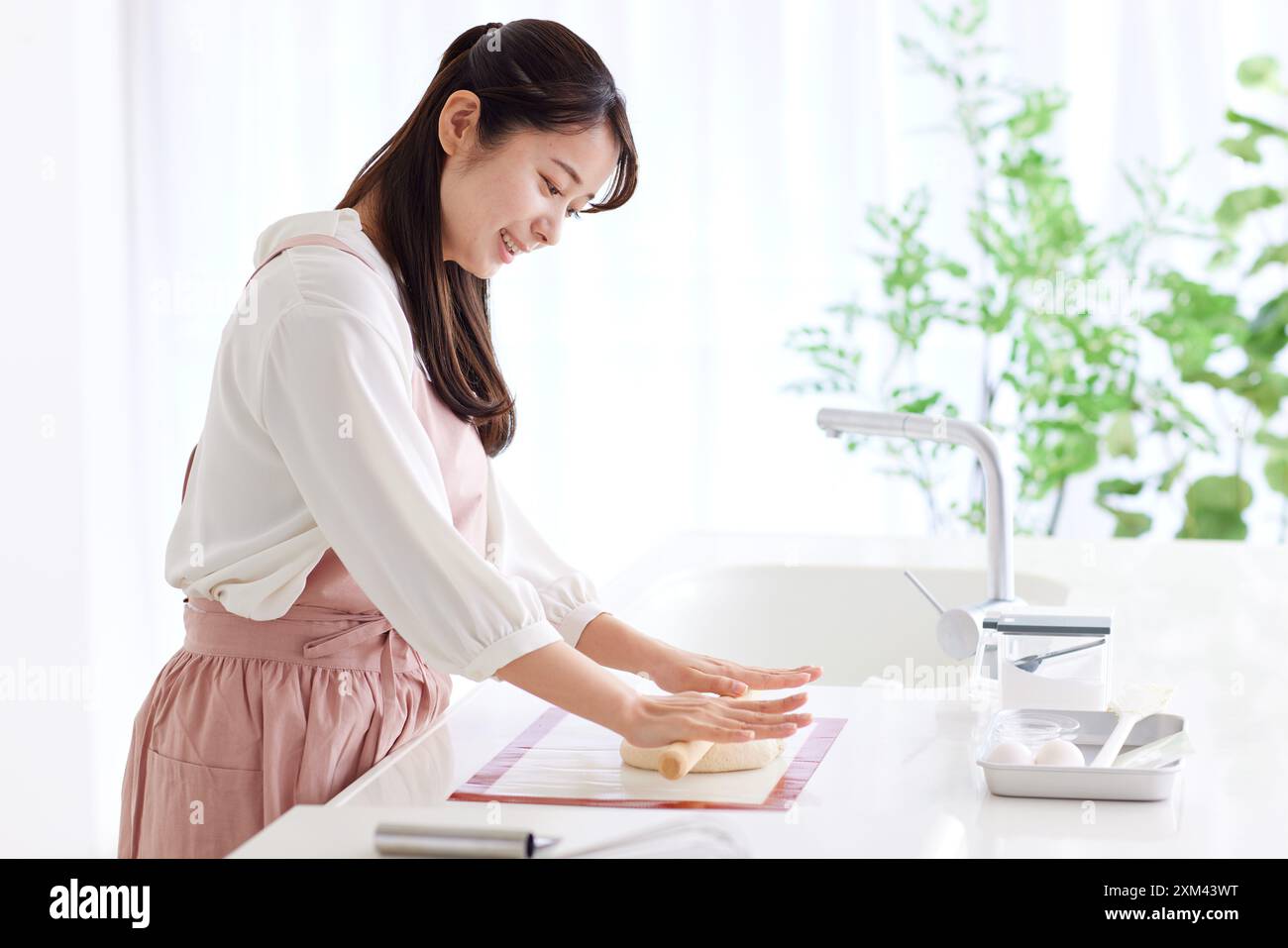 Japanese woman cooking in the kitchen Stock Photo - Alamy