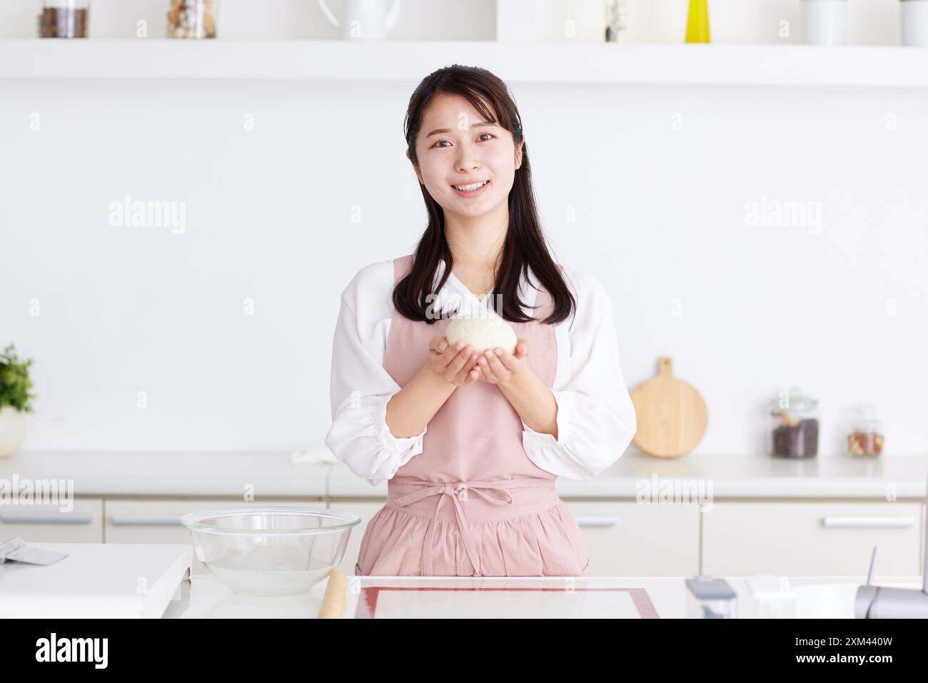 Japanese woman cooking in the kitchen Stock Photo - Alamy