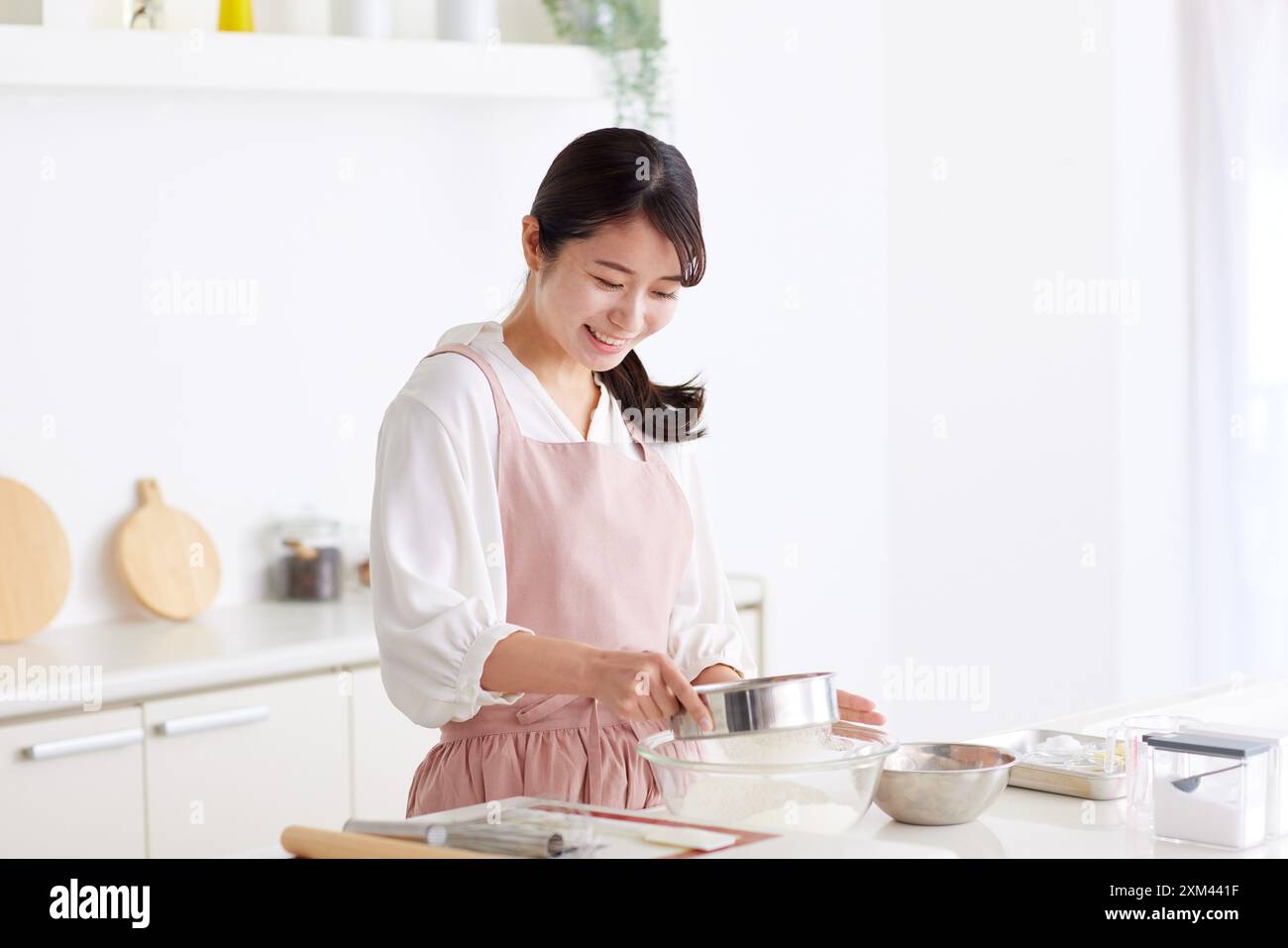 Japanese woman cooking in the kitchen Stock Photo - Alamy