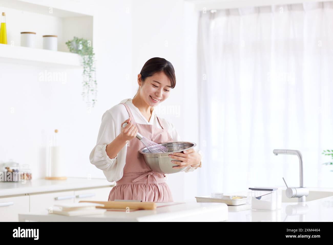 Japanese woman cooking in the kitchen Stock Photo - Alamy