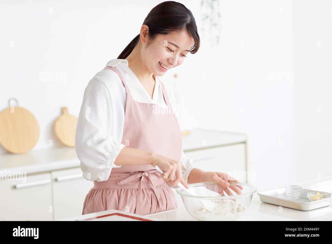 Japanese woman cooking in the kitchen Stock Photo - Alamy
