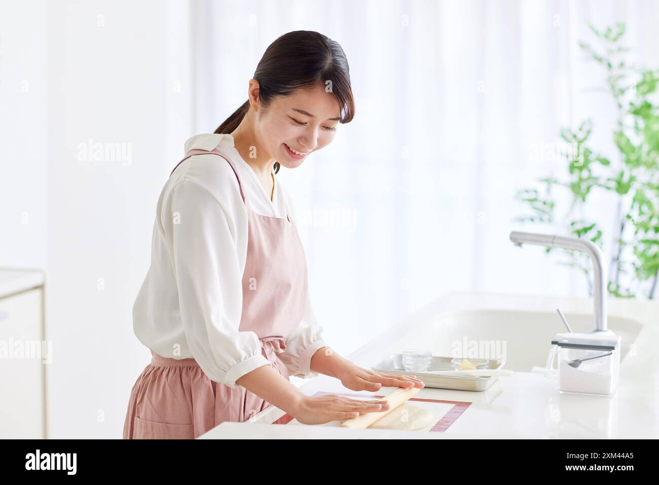 Japanese woman cooking in the kitchen Stock Photo - Alamy