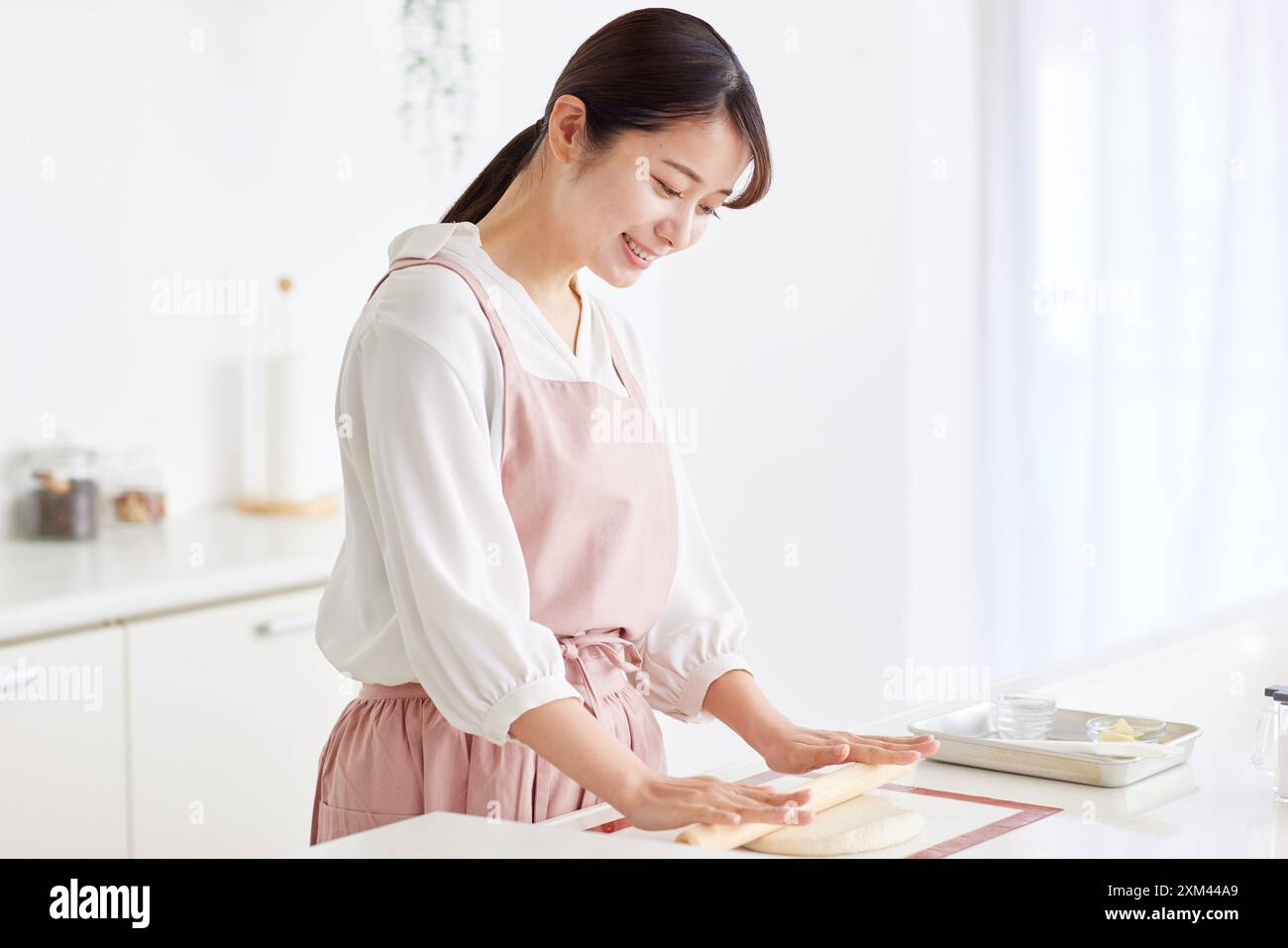 Japanese woman cooking in the kitchen Stock Photo - Alamy