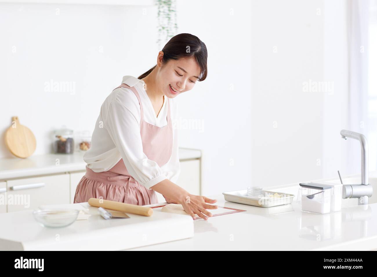 Japanese woman cooking in the kitchen Stock Photo - Alamy