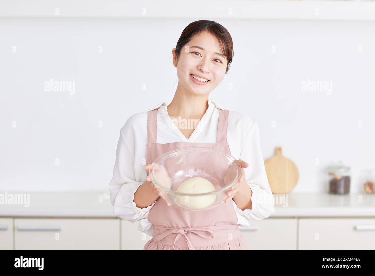 Japanese woman cooking in the kitchen Stock Photo - Alamy