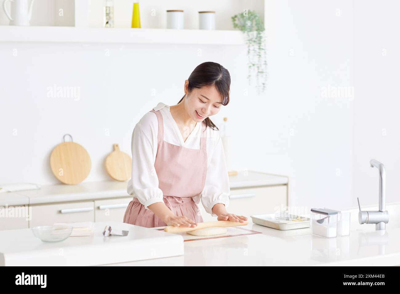 Japanese woman cooking in the kitchen Stock Photo - Alamy