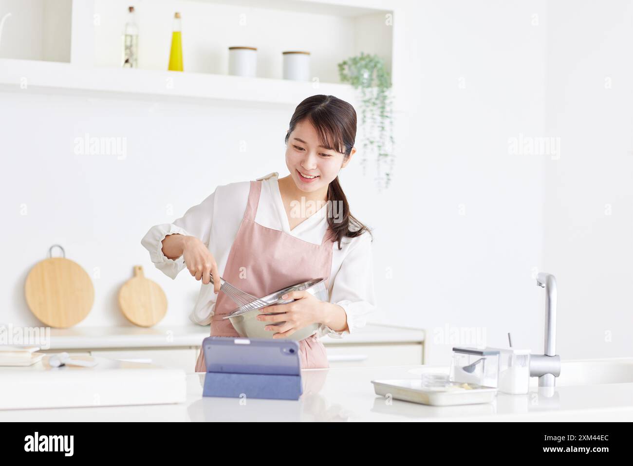 Japanese woman cooking in the kitchen Stock Photo - Alamy