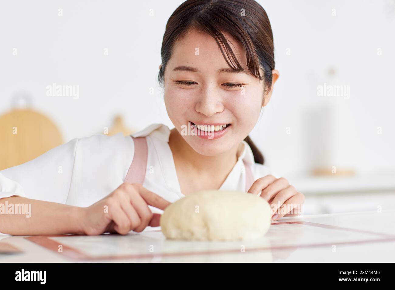 Japanese woman cooking in the kitchen Stock Photo - Alamy