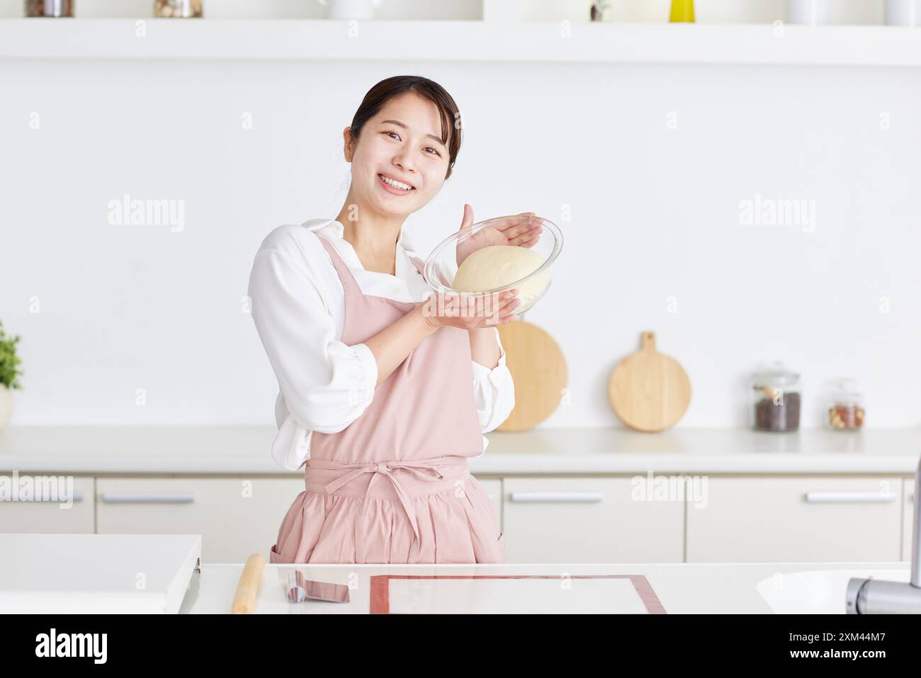 Japanese woman cooking in the kitchen Stock Photo - Alamy