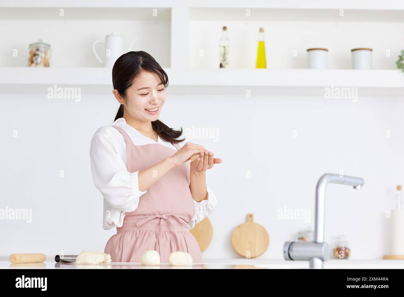 Japanese woman cooking in the kitchen Stock Photo - Alamy