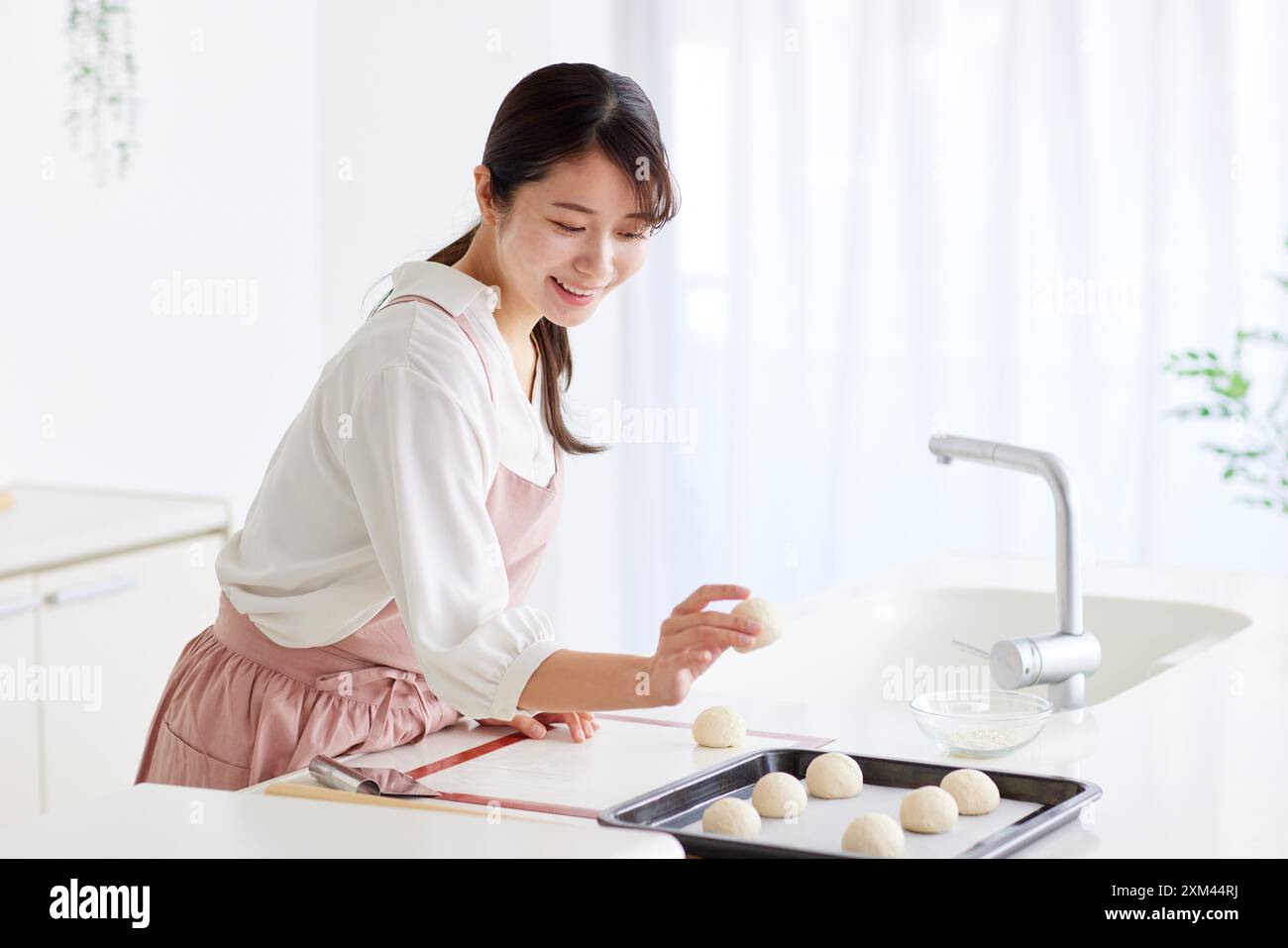 Japanese woman cooking in the kitchen Stock Photo - Alamy
