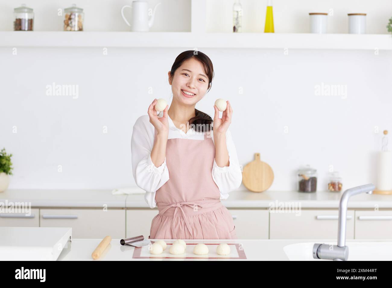 Japanese woman cooking in the kitchen Stock Photo - Alamy