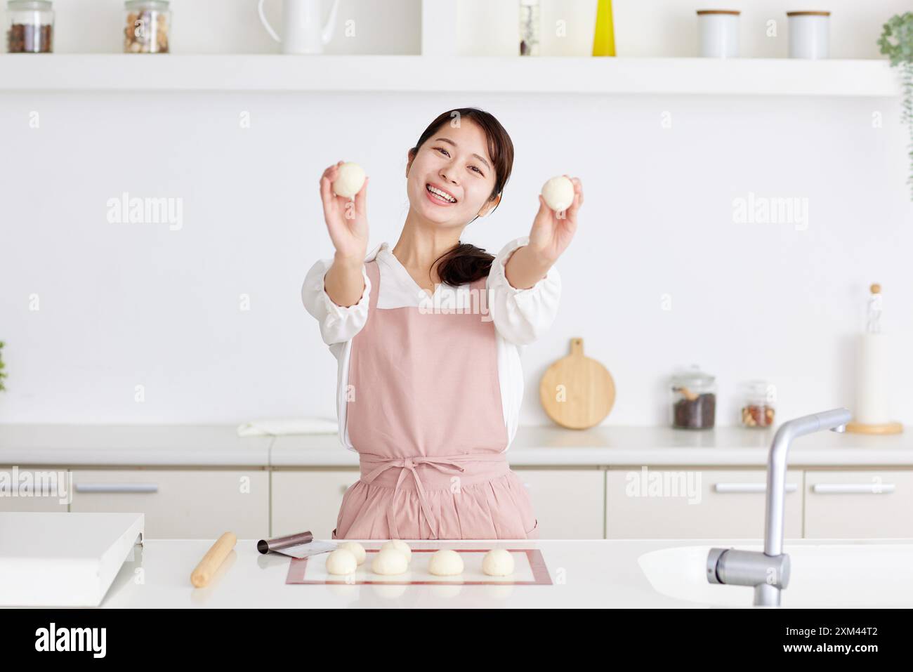 Japanese woman cooking in the kitchen Stock Photo - Alamy