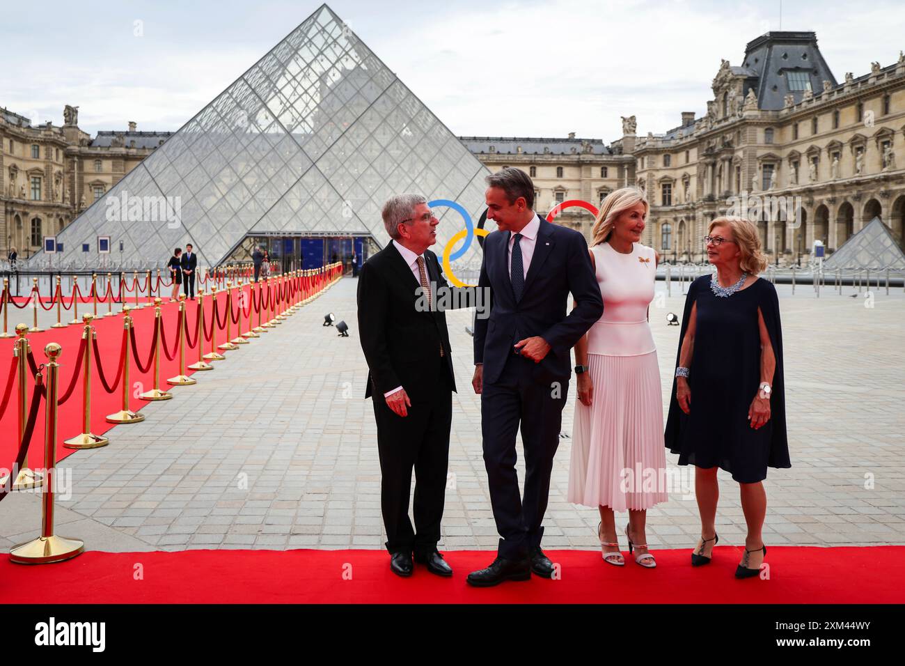 Thomas Bach, left, President of the International Olympic Committee ...