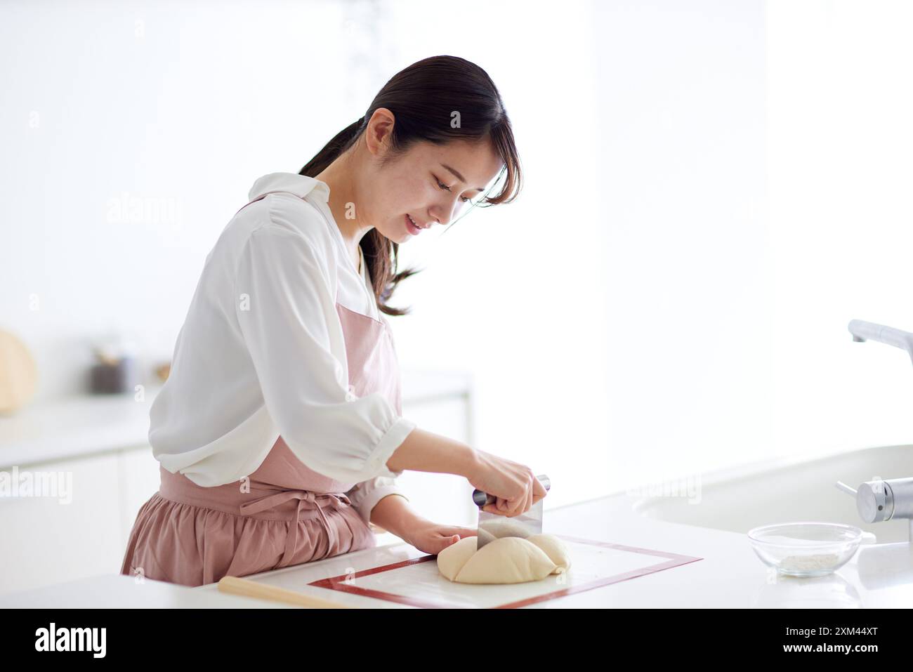 Japanese woman cooking in the kitchen Stock Photo - Alamy