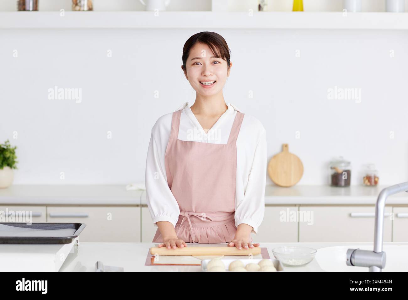 Japanese woman cooking in the kitchen Stock Photo - Alamy