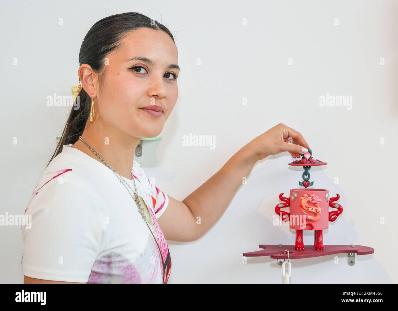 London, UK. 25th July, 2024. Artist Hannah Lim with her work 'Ruby ...