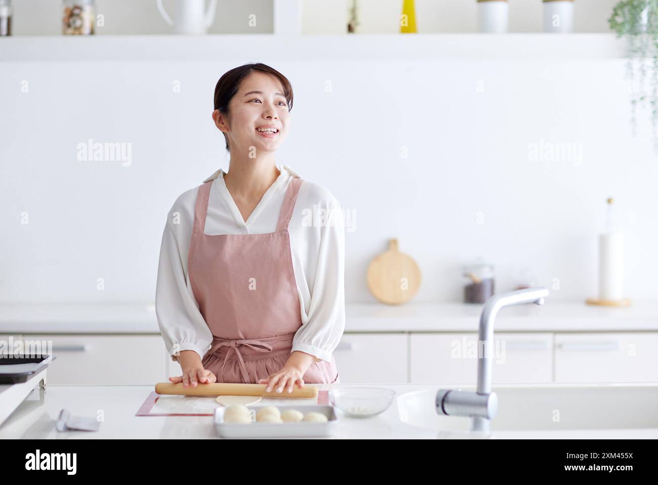 Japanese woman cooking in the kitchen Stock Photo - Alamy