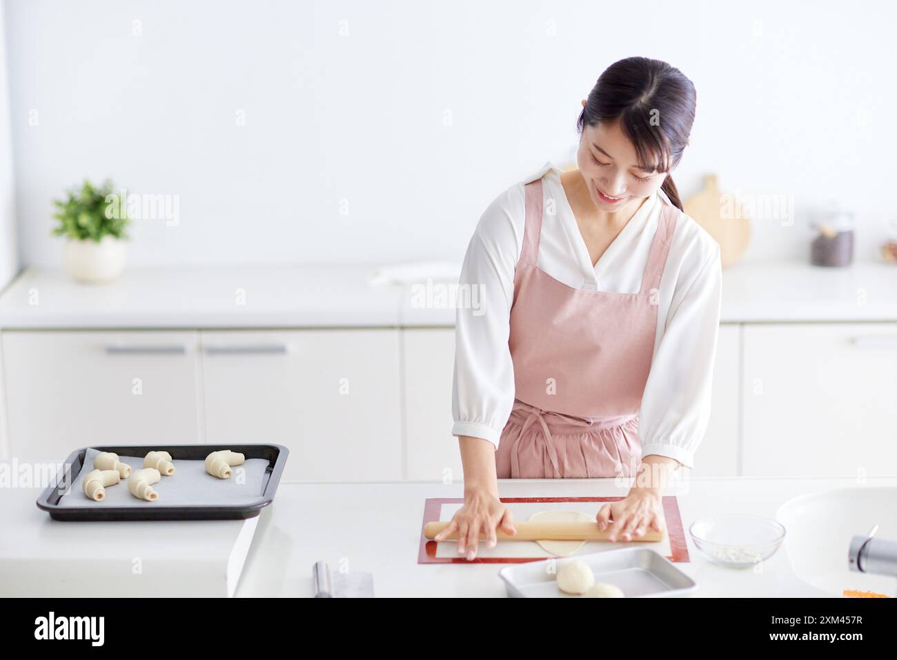 Japanese woman cooking in the kitchen Stock Photo - Alamy
