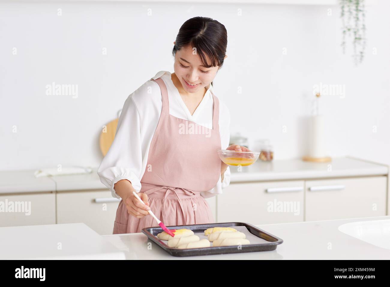 Japanese woman cooking in the kitchen Stock Photo - Alamy