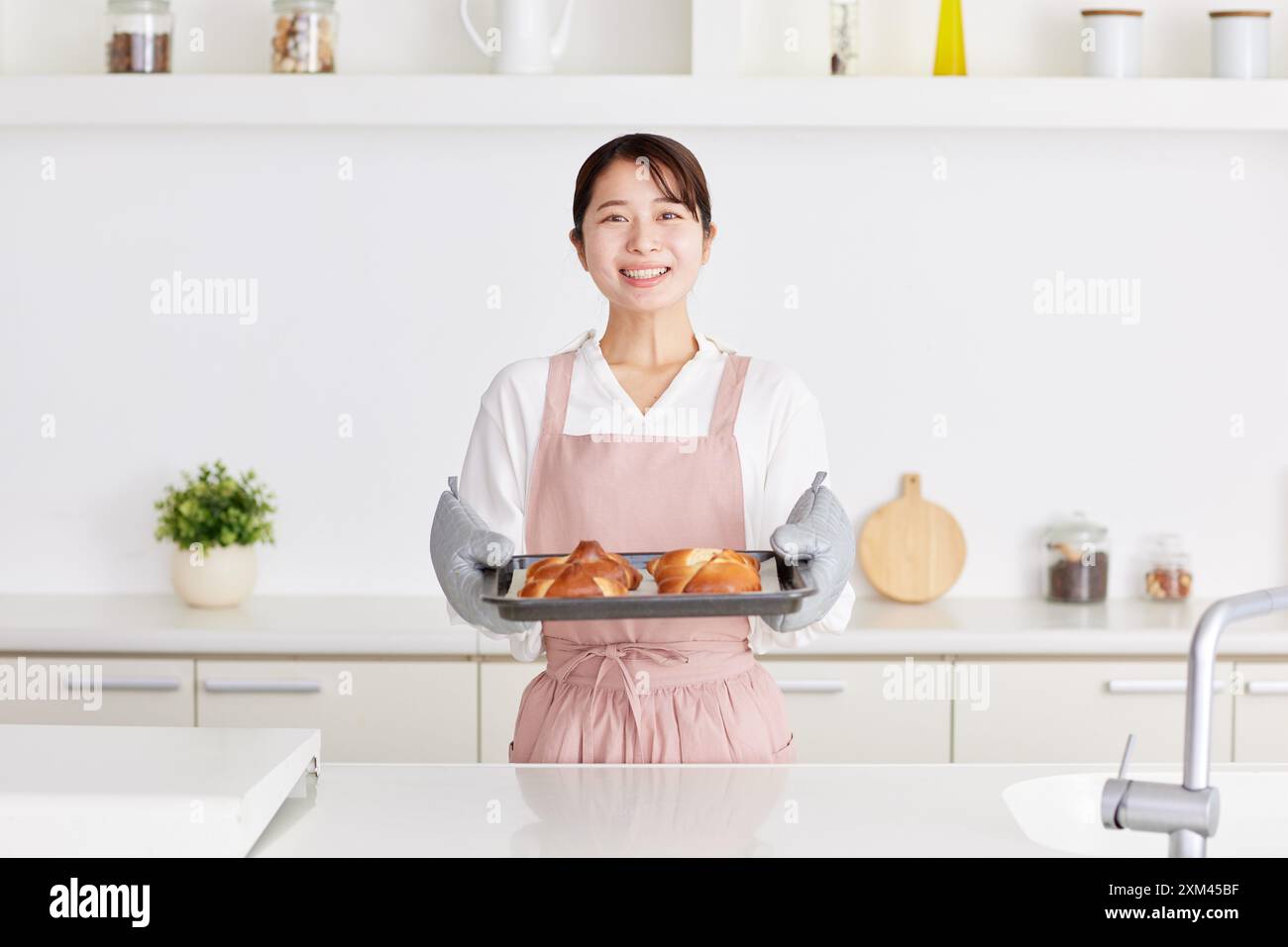 Japanese woman cooking in the kitchen Stock Photo - Alamy