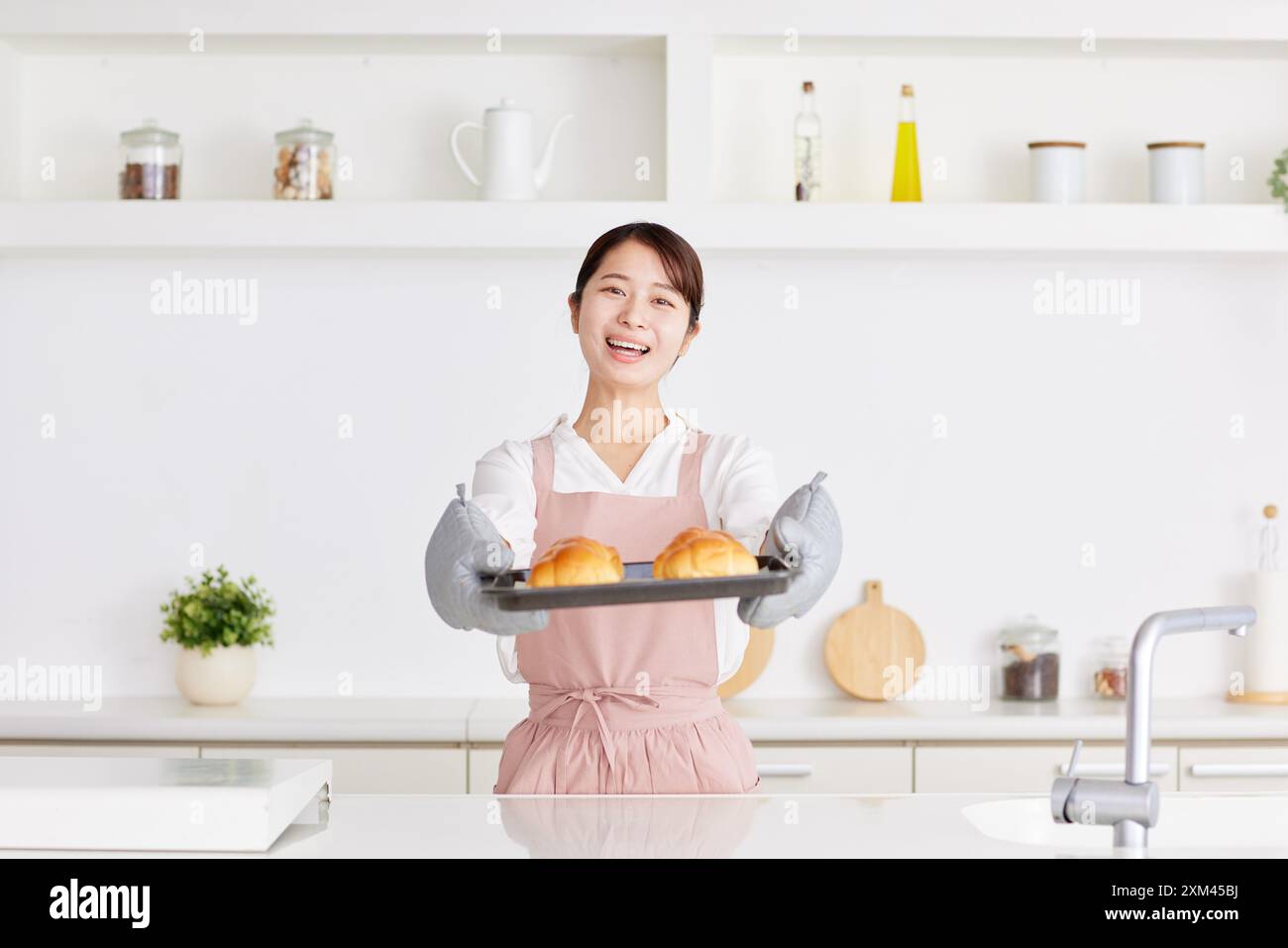 Japanese woman cooking in the kitchen Stock Photo - Alamy